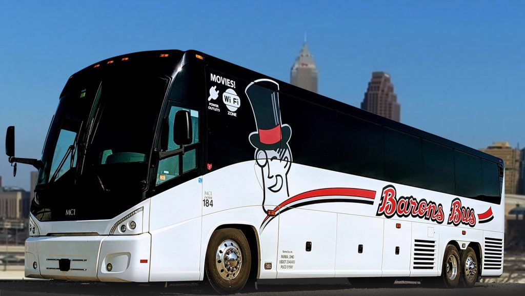 Barons Bus facing left against Cleveland skyline | Barons Bus